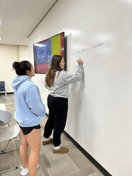 Students Writing On White Board | Southeastern Illinois College